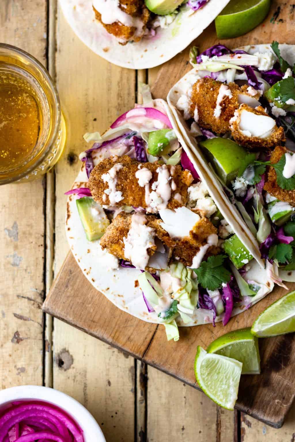Crispy Baked Fish Tacos with Creamy Cilantro Lime Slaw - Modern ...
